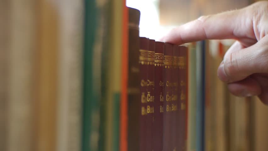 shelf books - taking out book Stock Footage Video (100% Royalty-free ...