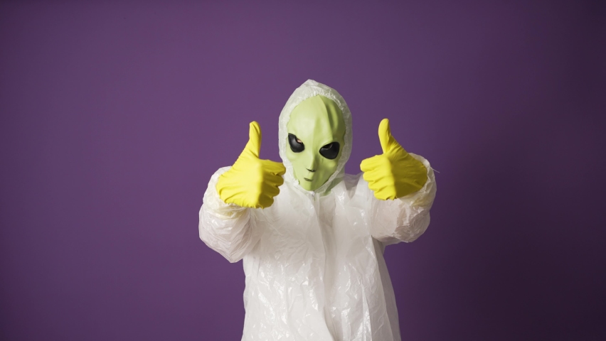 alien reptilian wearing yellow rubber gloves Stock Footage Video (100% ...