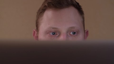 Young Guy Sitting Behind Screen Looking Stock Footage Video (100% ...