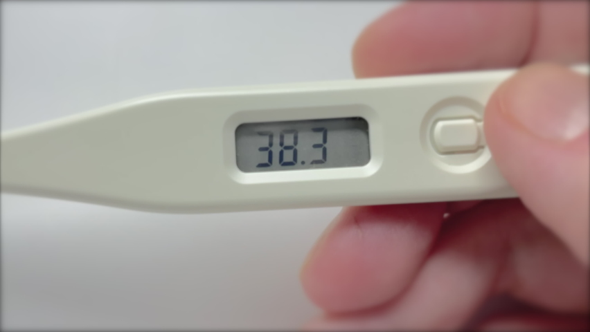 electronic thermometer indicating temperature rise woman's Stock ...