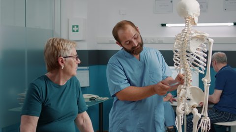 Osteopath Explaining Orthopedic Diagnosis On Human Stock Footage Video ...