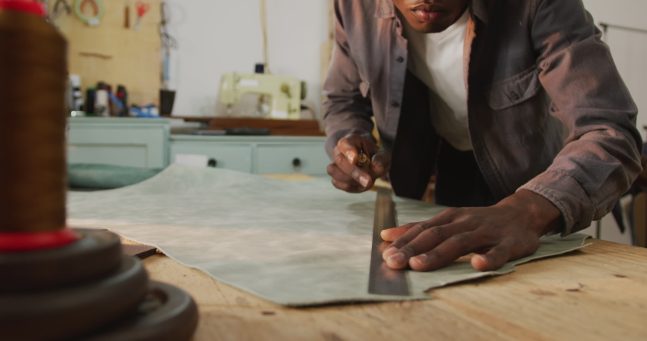 focused african american craftsman cutting piece Stock Footage Video ...
