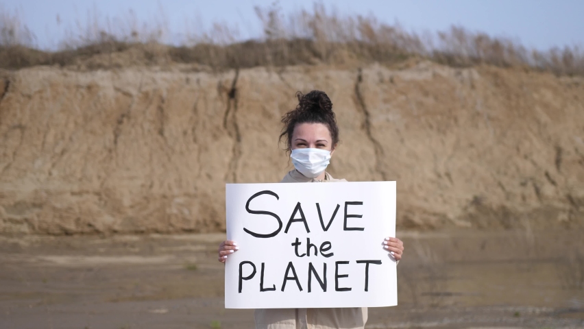 young woman volunteer activist holding environmental Stock Footage ...