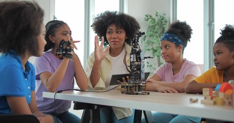 African Black Kids Playing Robotic Arm Stock Footage Video (100% ...