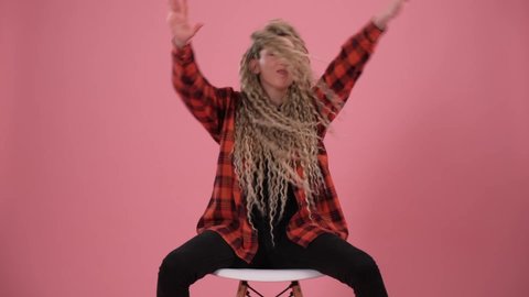 Girl Dancing While Sitting On Chair Stock Footage Video (100% Royalty ...
