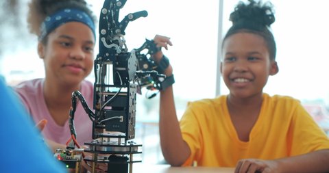 African Black Kids Playing Robotic Arm Stock Footage Video (100% ...