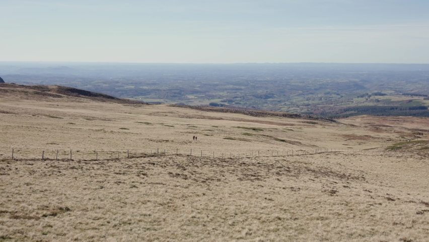 hikers walking on barren meadow down Stock Footage Video (100% Royalty ...