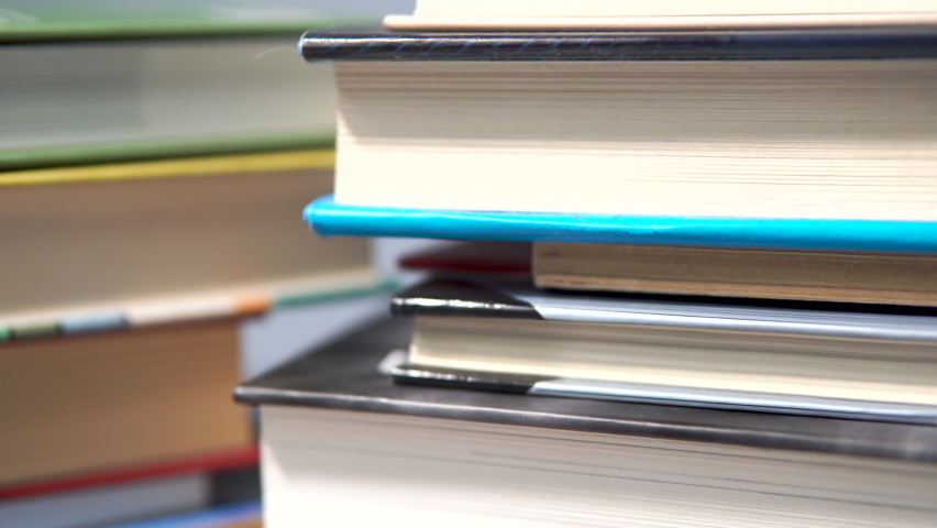 closeup pile books forming tower tilt Stock Footage Video (100% Royalty ...