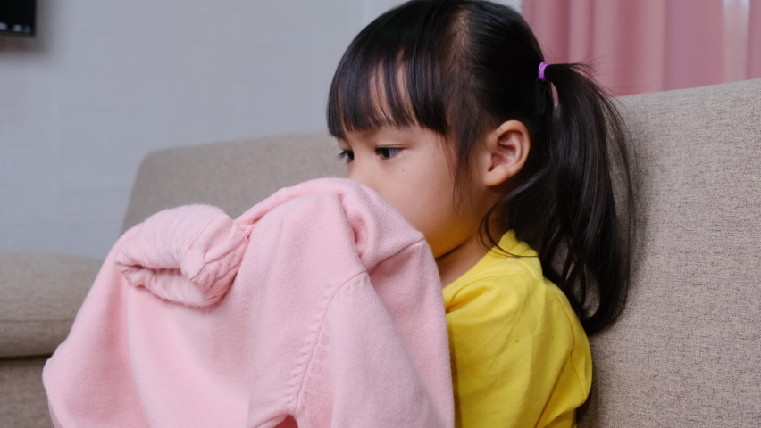 cute little girl sniffing stinky clothes Stock Footage Video (100% ...
