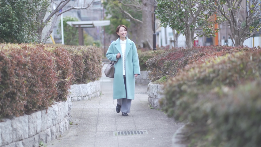 japanese woman walking outside smile Stock Footage Video (100% Royalty ...