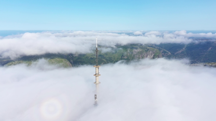 circling radio tower above clouds mountains Stock Footage Video (100% ...