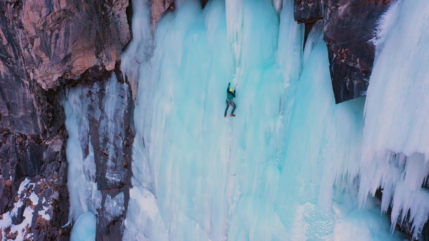 ice climbing on frozen waterfall aerial Stock Footage Video (100% ...