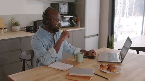 Man Working Kitchen Table Listening Music Stock Footage Video (100% ...