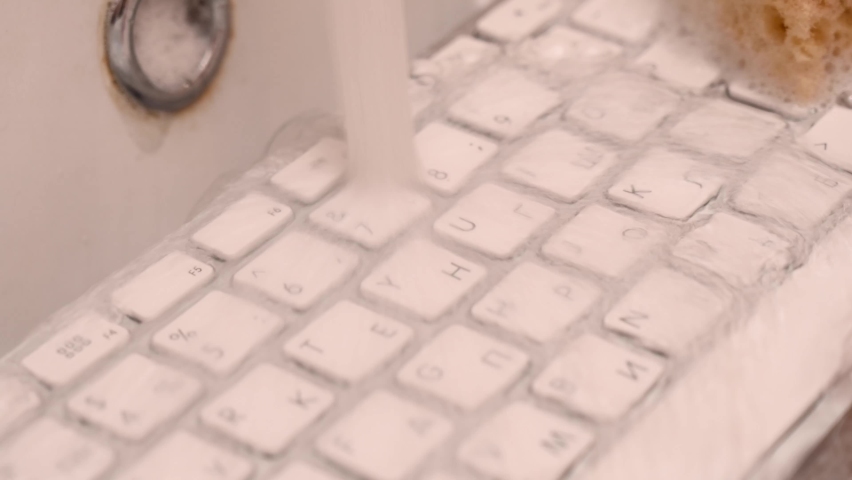 woman washing white computer keyboard sponge Stock Footage Video (100% ...
