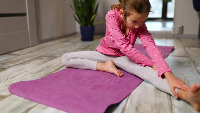 little girl doing stretching exercises practicing Stock Footage Video ...