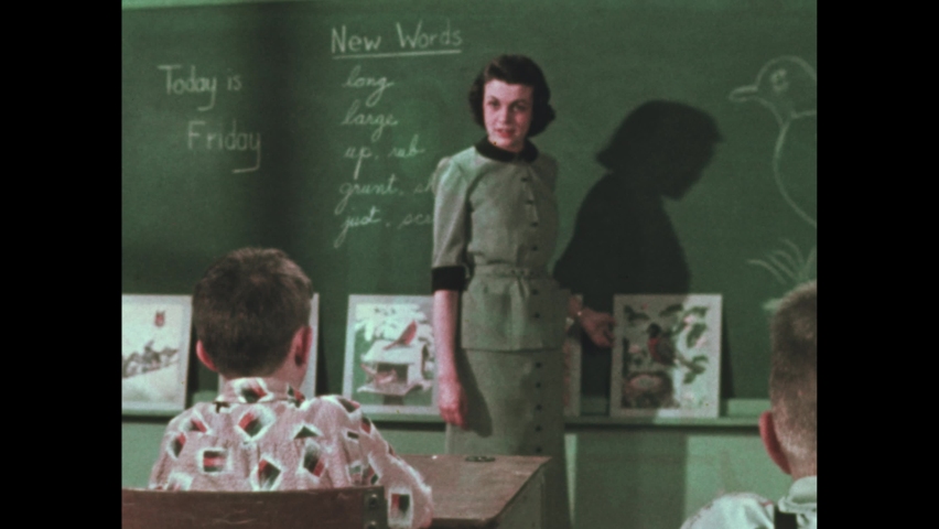 1950s classroom teacher stands chalkboard points Stock Footage Video ...