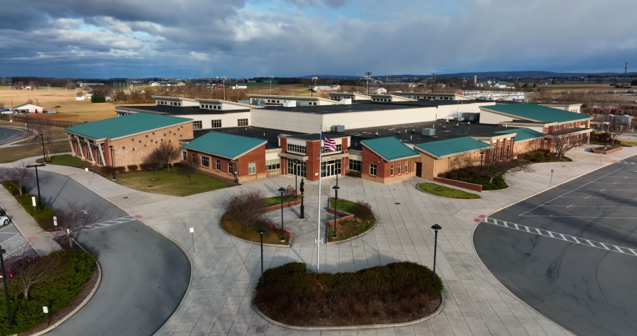 A daytime summer establishing shot of a typical two-story red brick ...