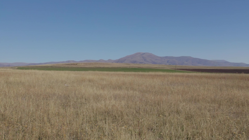 big fields near high mountains Stock Footage Video (100% Royalty-free ...