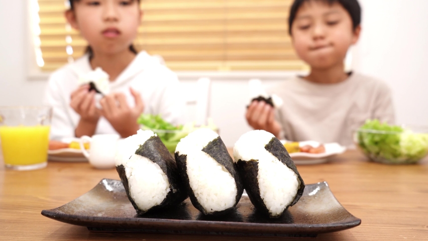 asian family eating rice balls breakfast Stock Footage Video (100% ...