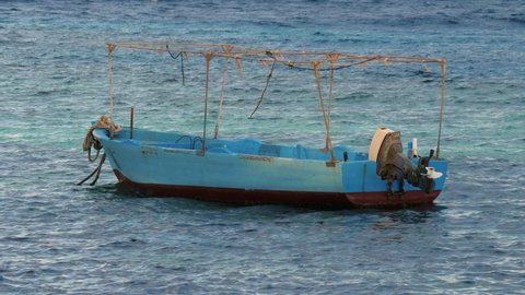 Empty Blue Motorboat Rocking On Red Stock Footage Video (100% Royalty ...
