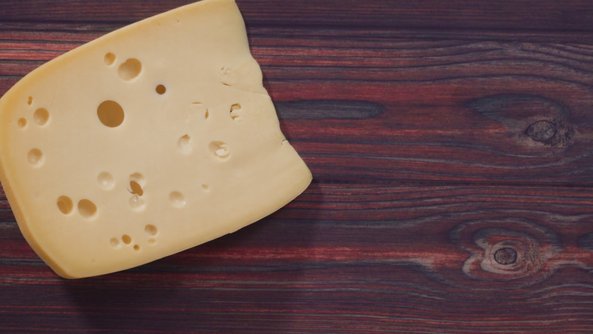 Swiss cheese wedge Stock Video Footage - 4K and HD Video Clips ...