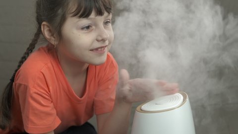 Girl Relax By Humidifier Works Happy Stock Footage Video (100% Royalty ...