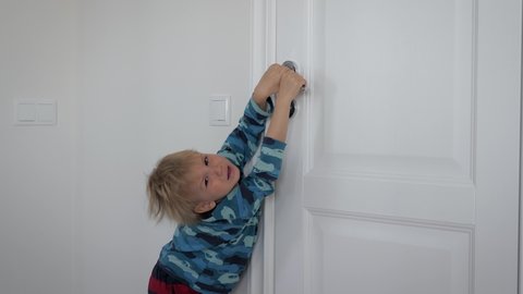 Moody Baby Kid Boy Pulls Door Stock Footage Video (100% Royalty-free ...