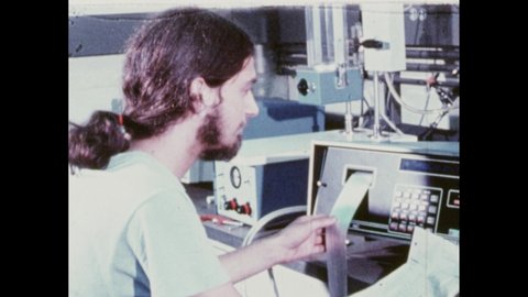 1980s Scientists Adjusting Equipment Spinning Elements Stock Footage ...