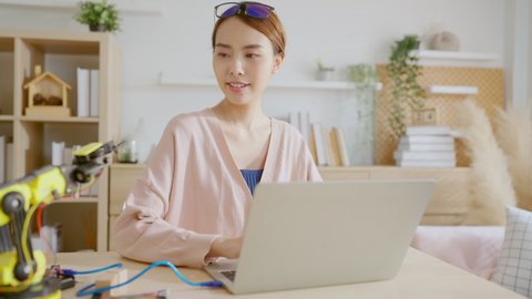 Smart Asian Female Programer Learning Robot Stock Footage Video (100% ...