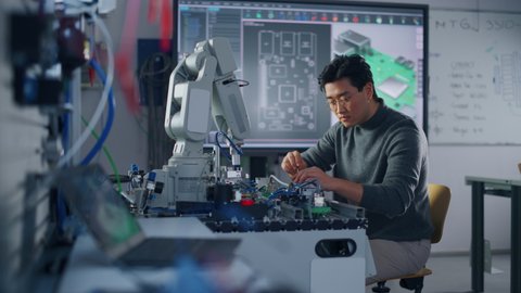 Asian Student Assembling Robotic Arm Screwdriver Stock Footage Video ...