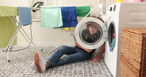 Happy Teen Boy Laundry Room Washing Stock Footage Video (100% Royalty ...