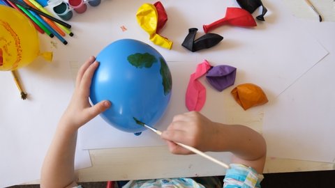 Child Making Planet Earth Day Balloon Stock Footage Video (100% Royalty ...