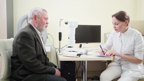 Doctor Interviews Elderly Man Before Being Stock Footage Video (100% ...