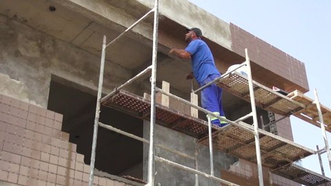 Bricklayer On Scaffold Laying Tiles On Stock Footage Video (100% ...