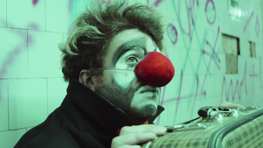 sad clown makeup red nose sitting Stock Footage Video (100% Royalty ...