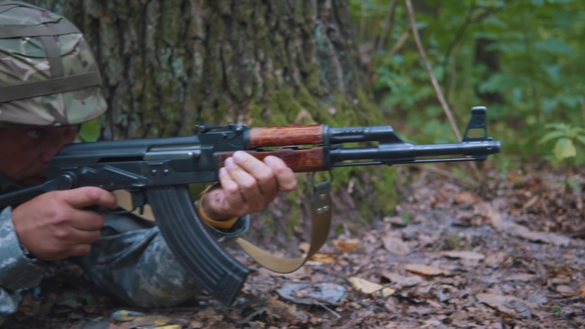 sniper aiming behind a tree Videos of People | Creative Market