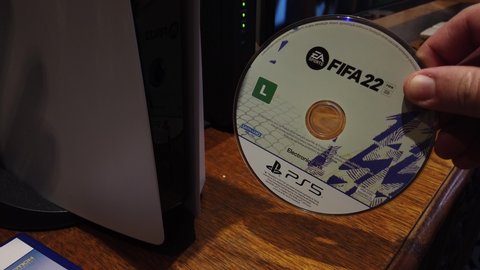 Inserting Fifa 22 Dvd Disk Playstation Stock Footage Video (100% ...