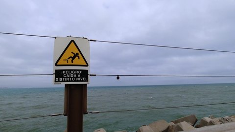 Danger Falling Sign Near Sea Warning Stock Footage Video (100% Royalty ...
