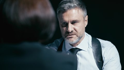 Serious Male Investigator Questioning Female Suspect Stock Footage ...