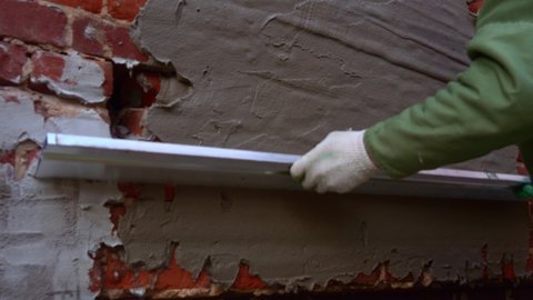 Bricklayer Levels Plaster On Brick Wall Stock Footage Video (100% ...