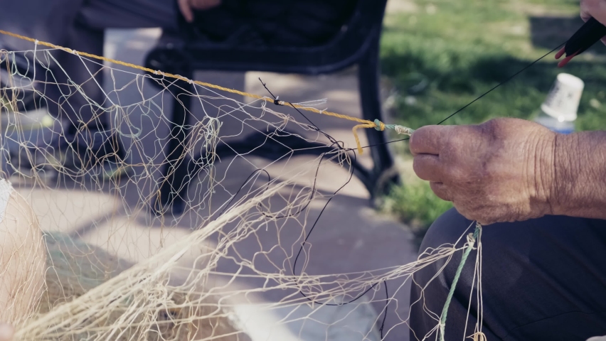 Fisherman mending a net Stock Video Footage - 4K and HD Video Clips ...