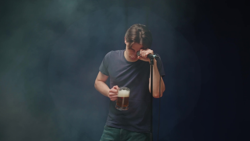 drunk man singing on stage drinking Stock Footage Video (100% Royalty ...