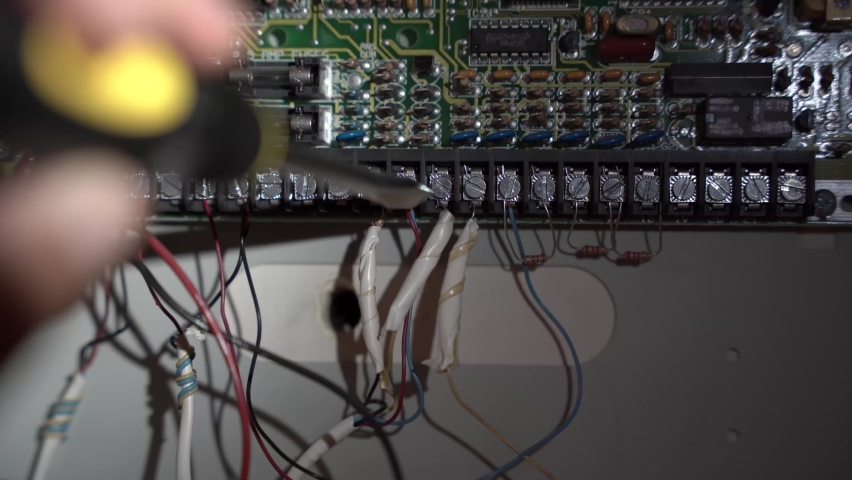 loosening electrical terminal screws removing wires Stock Footage Video ...