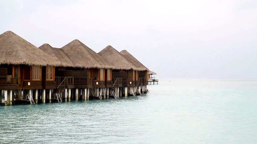 tropical resort water huts over blue Stock Footage Video (100% Royalty ...