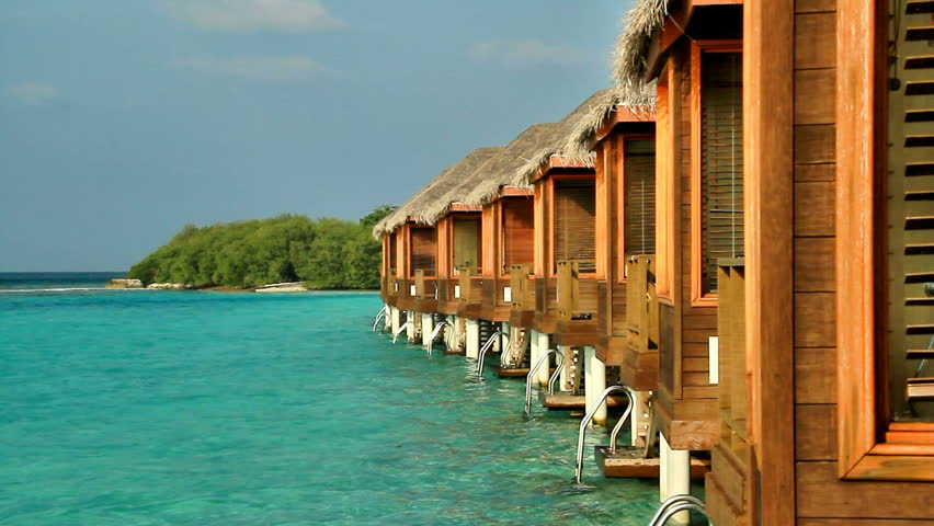 tropical resort water huts over blue Stock Footage Video (100% Royalty ...