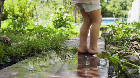 Close Legs Playful Baby Barefoot Stomping Stock Footage Video (100% ...