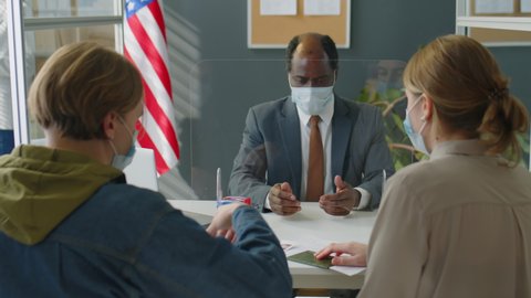 African American Consular Officer Checking Passport Stock Footage Video ...