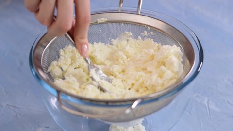 Woman Rubs Cottage Cheese Sieve Home Stock Footage Video (100% Royalty ...