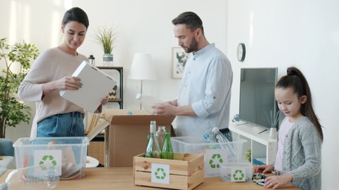 Young Family Sorting Out Trash Recycling Stock Footage Video (100% ...