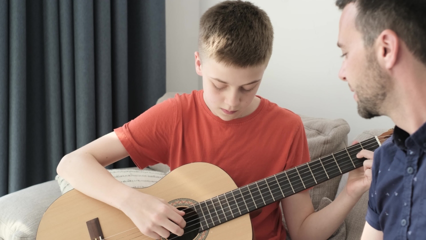 949 Teenage boy playing guitar Stock Video Footage - 4K and HD Video ...